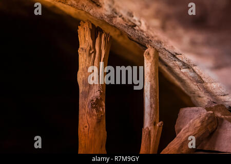 An exposed wall showing jacal construction technique of posts and mud ...