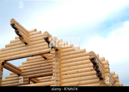 New suburban house from smooth logs and soft motley roof tile in sunny ...