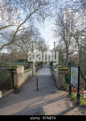 Primrose Hill Bridge, Regent's Park, London, shrouded in the golden ...
