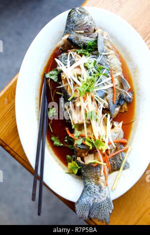 China, Beijing, Chinese fish recipe in the village of Beigou Stock ...