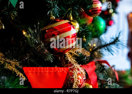 Magically decorated Christmas Tree with balls, ribbons and garlands on ...