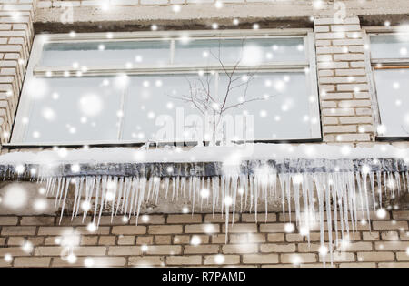 icicles on building or living house facade Stock Photo - Alamy