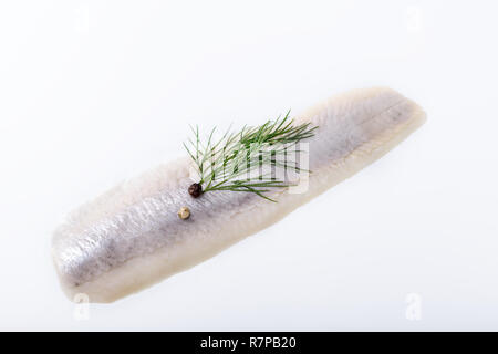 Herring flap with oil, pepper, dill and onion isolated on white Stock ...