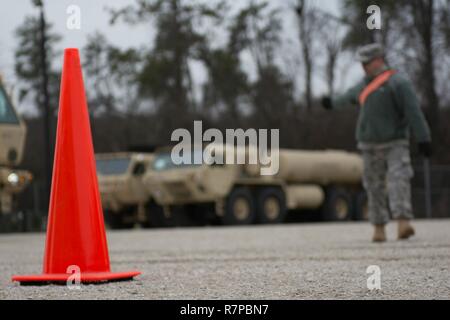 A Soldier with HHC 416th Theater Engineer Command ground guides an ...