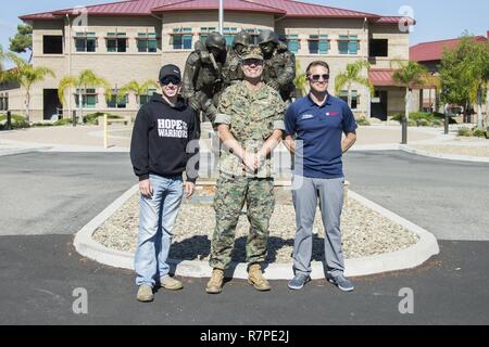 U.S. Marine Corps Col. Brandon W. Graham (left), the commanding officer ...