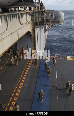 U.S. Marine Lance Cpl. Gage Kirkpatrick, a satellite transmissions ...
