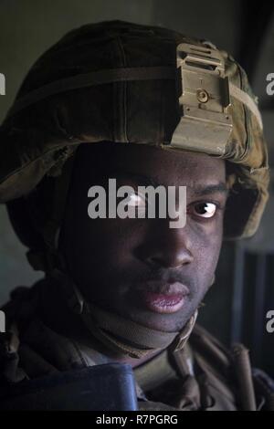 U.S. Marine Lance Cpl. Gage Kirkpatrick, a satellite transmissions ...