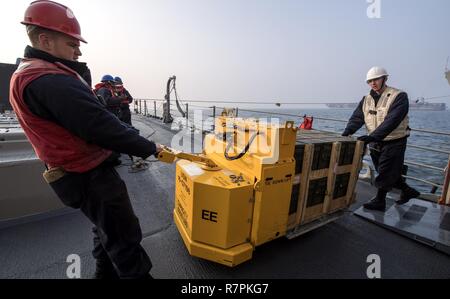 US Navy Lt.j.g. right, and Gunners Mate 3rd Class stand watch on the ...