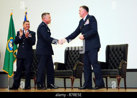 Col. Gent Welsh, commander of the Washington Air National Guard's 194th Wing, presents the ...