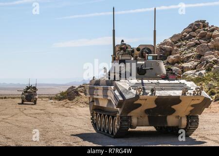 Armored Opposition Forces (OPFOR) from the U.S. Army engage the 401st ...