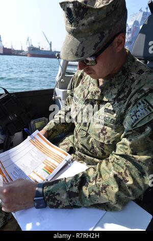 U.S. Coast Guardsmen from the coastal buoy tender USCGC Maria Bray (WLM ...