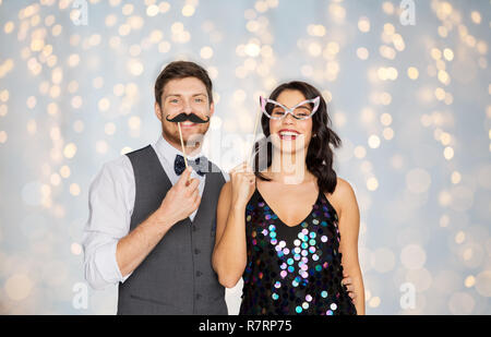 happy couple with party props having fun Stock Photo - Alamy