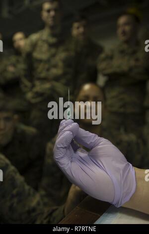 U.S. Navy corpsmen with the 31st Marine Expeditionary Unit, and a ...