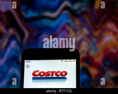 Costco Retail company logo seen displayed on smart phone Stock Photo ...