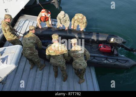U.S. Coast Guardsmen from the coastal buoy tender USCGC Maria Bray (WLM ...