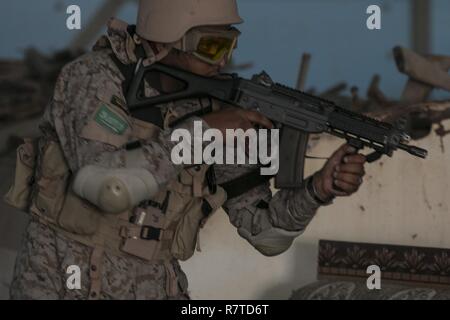 A Kuwaiti special operations soldier clears a warehouse during a ...