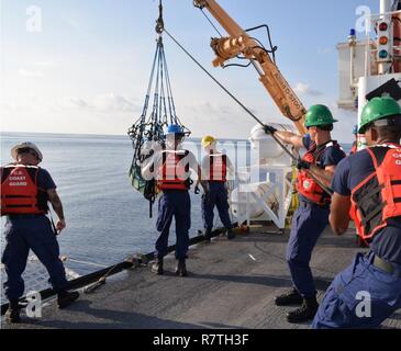The U.S. Coast Guard Cutter Resolute (WMEC 620) conducts small boat and ...