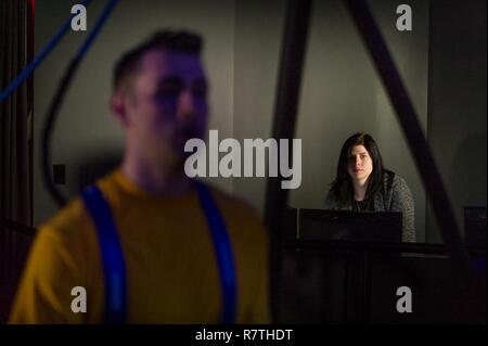 A Traumatic Brain Injury (TBI) patient walks through a virtual reality ...