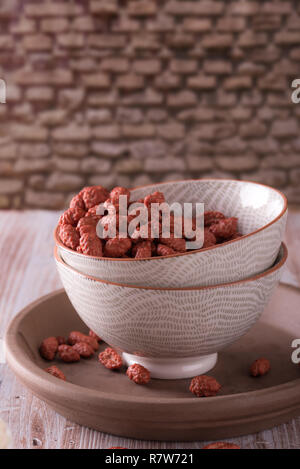 Bowls with sugar on color wooden background Stock Photo - Alamy