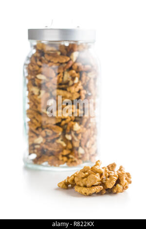 The walnut kernels in jar isolated on white background. close-up walnut ...