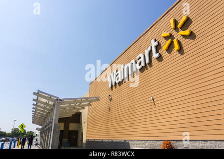 Walmart exterior facade brand and logo signage in white letters with a ...