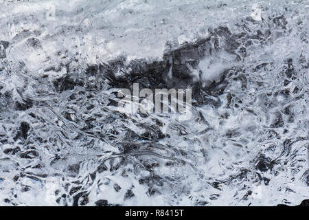 Clear ice on black lava Stock Photo - Alamy