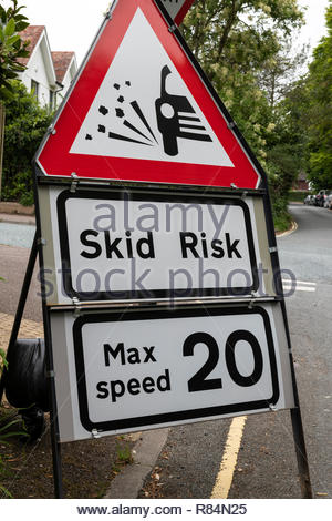 Temporary Skid risk road sign near skid marks Stock Photo: 90869262 - Alamy