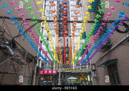 Chengdu, China. 13th Dec, 2018. Colorful pinwheels decorate the street ...