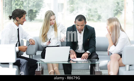 concentrated business team at the workplace thinking about business ...