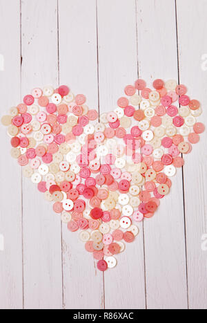 Heart laid out from the buttons Stock Photo - Alamy