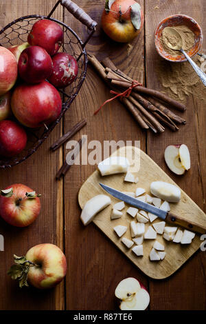 Composition with fresh apples and cinnamon sticks on wooden table Stock ...