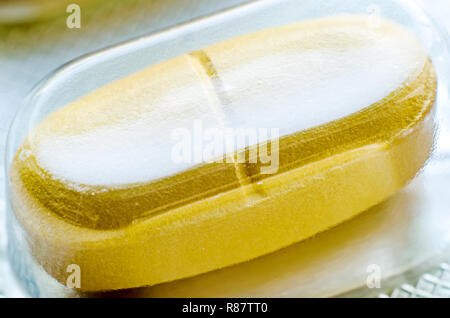 Big Yellow Pill Stock Photo - Alamy