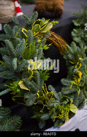 A Christmas wreath made with Ilex and Spruce foliage Stock Photo - Alamy