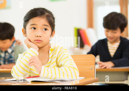 Young Student Looking Lost In Class Stock Photo: 228877873 - Alamy