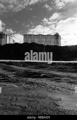 Black and white photo of a multi-storey residential building under ...
