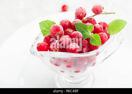Frozen red currant with mint in sauce pan Stock Photo - Alamy