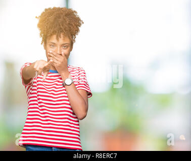 Young black woman laughing while pointing finger at herself isolated ...