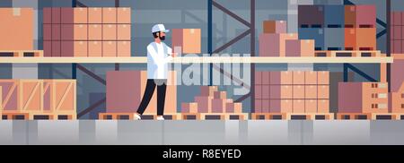 storekeeper warehouse worker puts cardboard box on shelf man courier ...