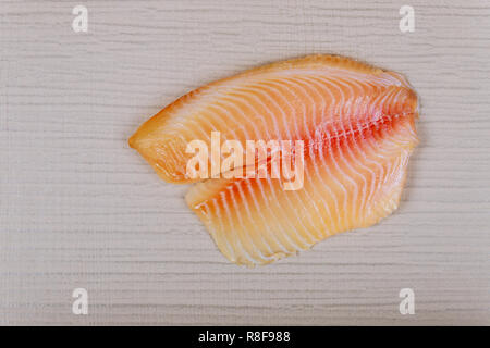 Raw tilapia fish fillet for cooking Stock Photo - Alamy