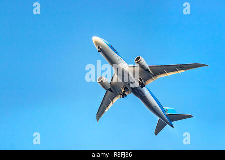 A low angle view of a TUI aircraft landing in stormy weather and ...