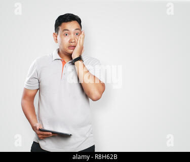 Photo of amazed shocked young man reaction news discount shopping ...