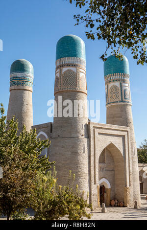 Detail of the tile work and a minaret. At the Silk Road site, The ...