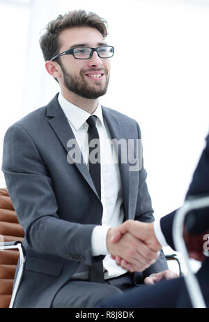 wo focused coworkers sitting together in a modern office Stock Photo ...