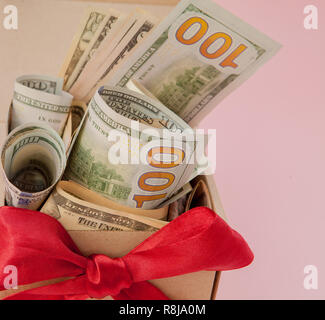 Bundle of dollars in present box with bow isolated on white Stock Photo ...