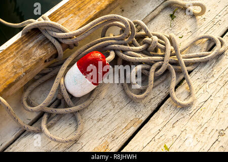 Old white and red wooden fishing boat detail. Shot with a selective ...