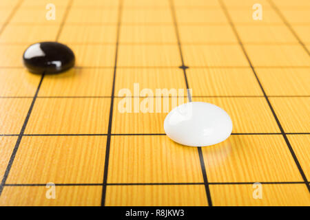 Close up shot of a Go board game, with black and white stones Stock ...