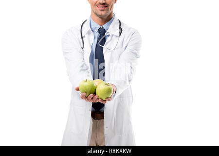 Cropped hands of doctor holding fresh orange with measuring tape for ...