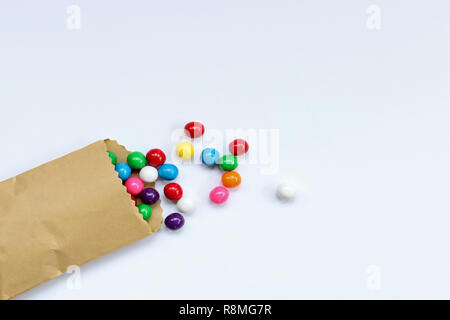 Candy spilling out of bag Stock Photo - Alamy