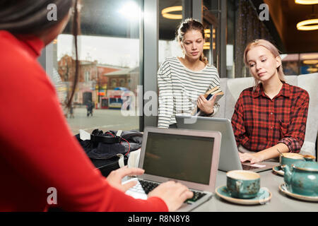 Group of students study in modern school classroom. Beautiful female ...