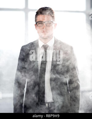 young businessman in a smoky office Stock Photo - Alamy